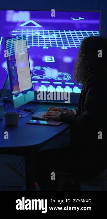 A dedicated and focused individual actively engages with computer ...