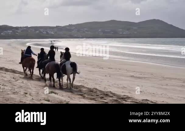Horse riding on Narin beach by Portnoo, County Donegal, Ireland Stock ...