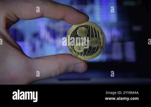 An upclose image showing a persons hand gripping a Ripple ...