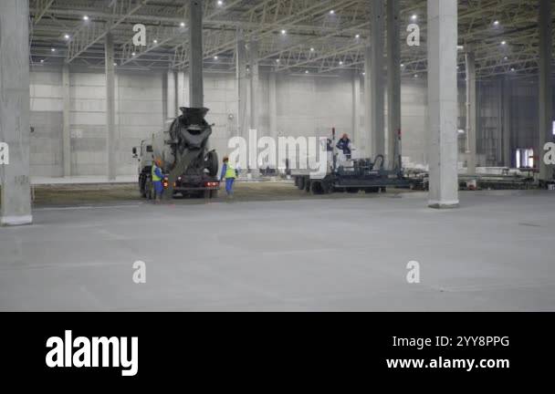 An expansive construction site is showcasing various heavy machinery ...