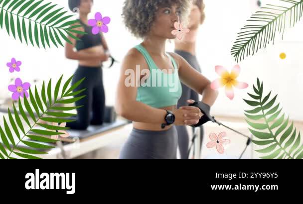 Tropical flowers and leaves animation over women exercising in fitness ...