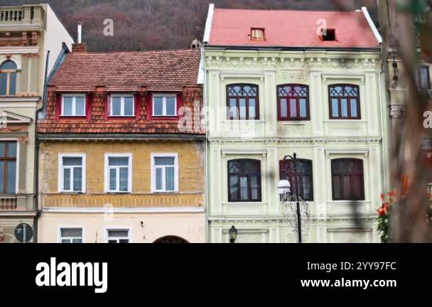 The facade of multiple, old style buildings in Brasov, Romania Stock ...