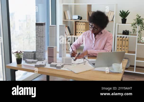 African woman architect uses compass to design modern city project in ...
