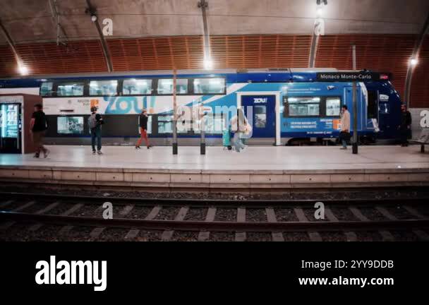 Monte Carlo, Monaco - October 4, 2024: People and trains moving through ...