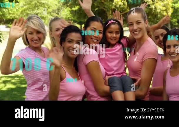 Group of women in pink shirts celebrating with numbers animation over ...
