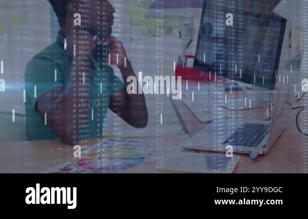 Financial data and stock market animation over man working on computer ...