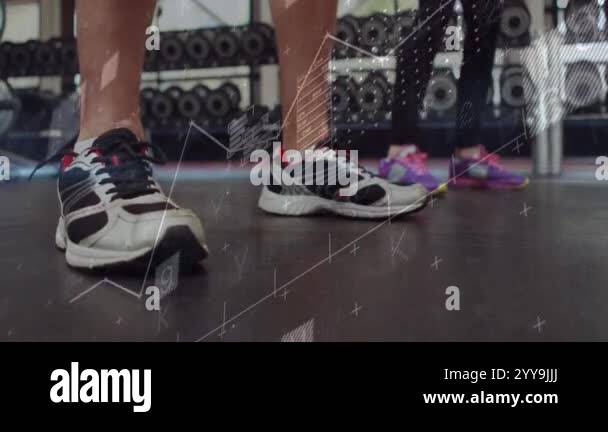 Working out, feet in motion with fitness data animation in background ...