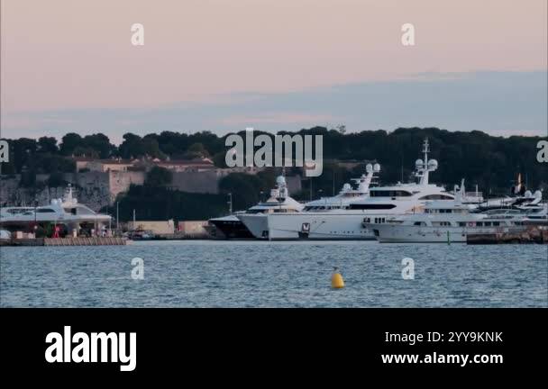 Multiple boats docked in the Port Pierre Canto in Cannes, France in the ...