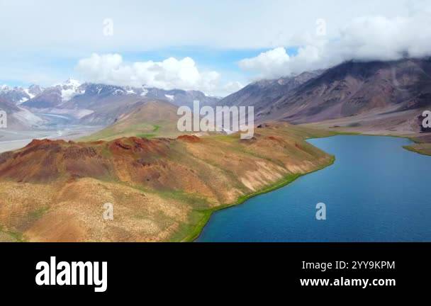 Aerial view of chandratal lake surrounded by snow-capped Himalayan ...