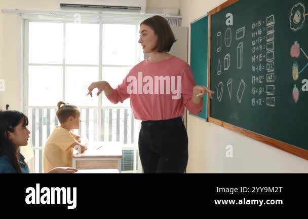 Caucasian teacher request student to raise hand up to answer question ...