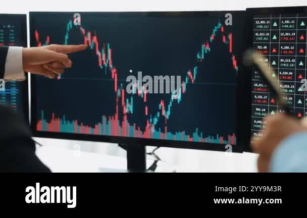 Business investors in stock trading company analyzing stock exchange ...