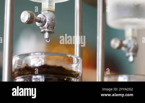 Close-up of a coffee brewing apparatus in a cafe setting, showcasing ...