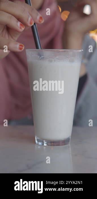 A wonderfully delicious and creamy beverage served in a tall glass for ...