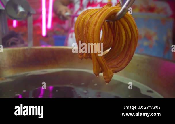 Close-up of golden churros freshly-cooked, showing their crispy outside ...