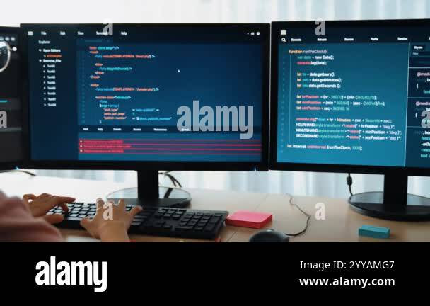 Slow motion back end software developer engineer for computer programming working together on ...