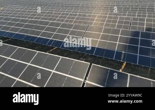 Aerial fly over view of industrial sized solar panel farm.Close-up of ...