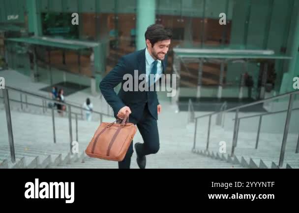 Happy smart business man dancing to celebrate good news about getting ...