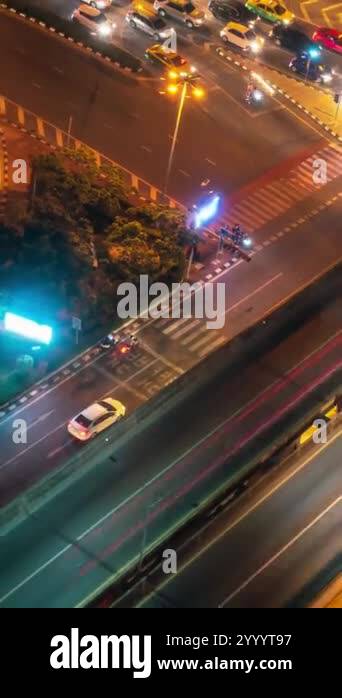 Time lapse of busy highway road junction in metropolis city center at ...