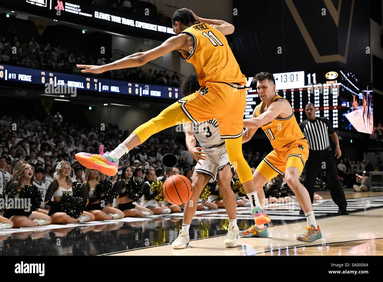 Vanderbilt guard Tyler Tanner (3) passes the ball under Missouri guard ...