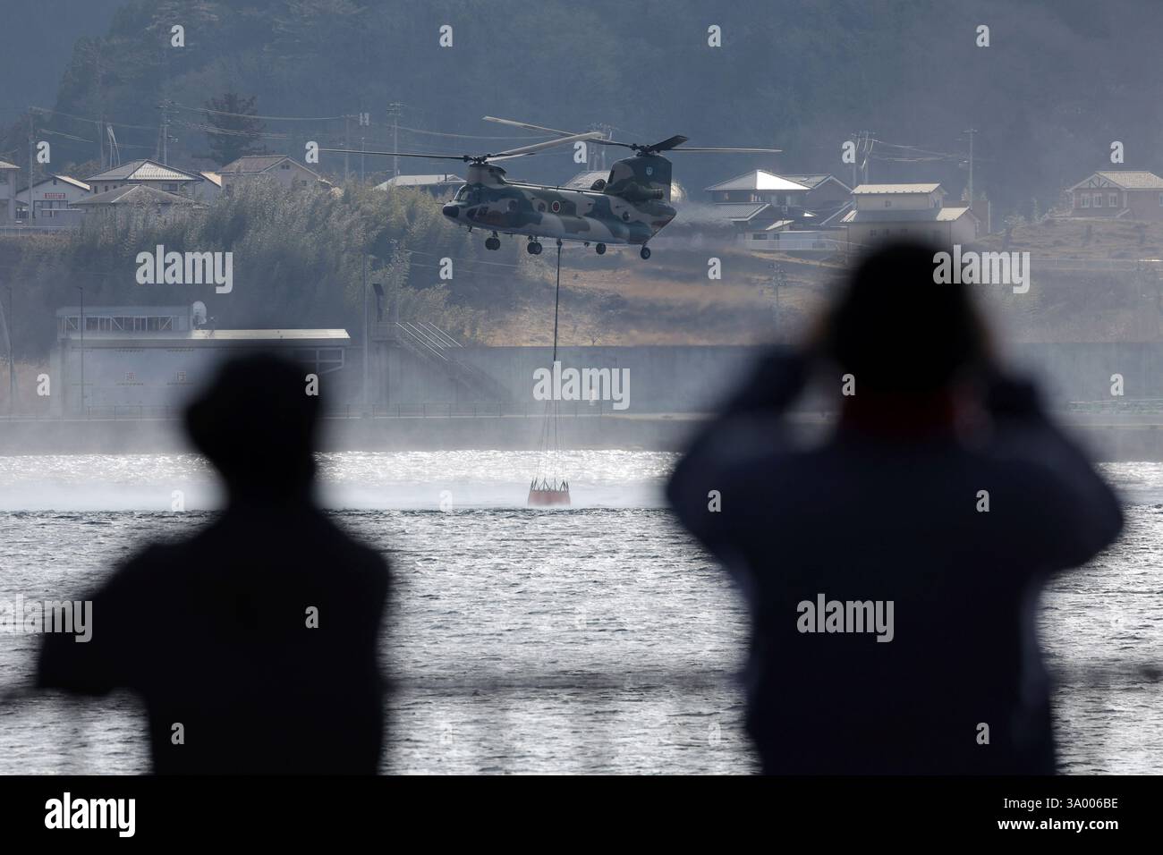 Japan Self-Defense Force helicopter collects seawater from Ofunato Port ...