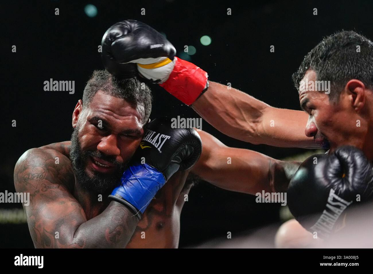 Venezuela's Johan Gonzalez, right, exchanges punches with Jarret Hurd ...