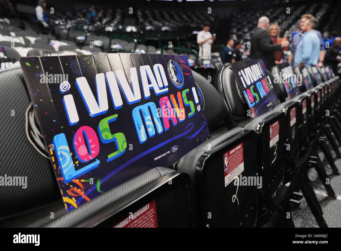 Signs placed on seats read "Viva Los Mavs!" before an NBA basketball ...