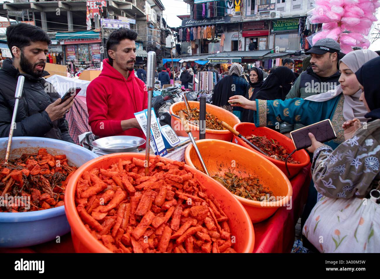 Kashmiri Muslims buy pickles at a local market in Srinagar, the ...