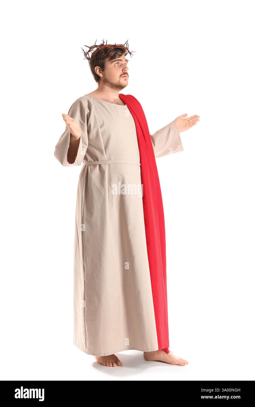 Man in Jesus robe and crown of thorns with outstretched hands on white ...