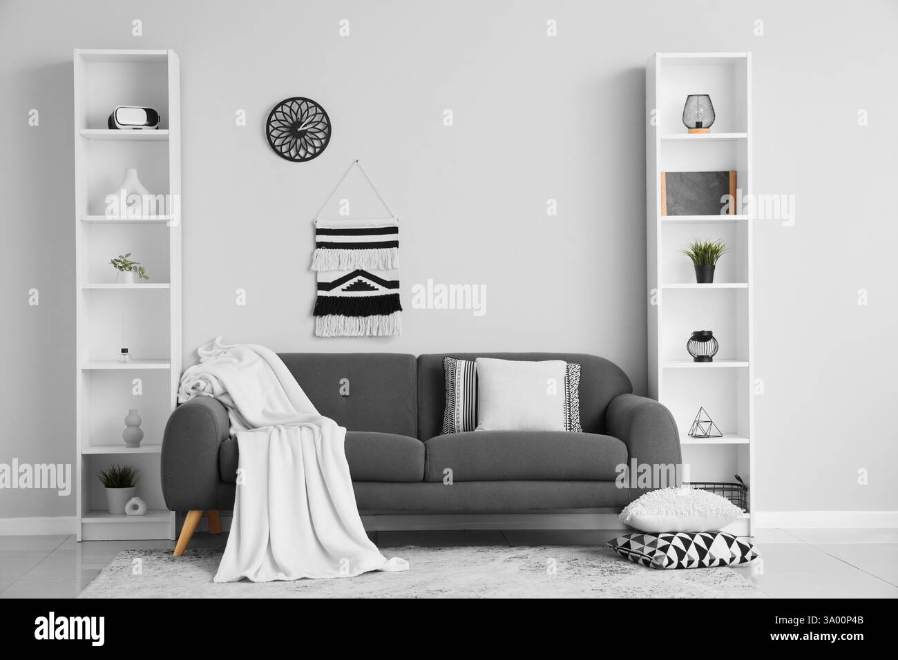Interior of living room with black sofa and shelf units. Yin Yang ...