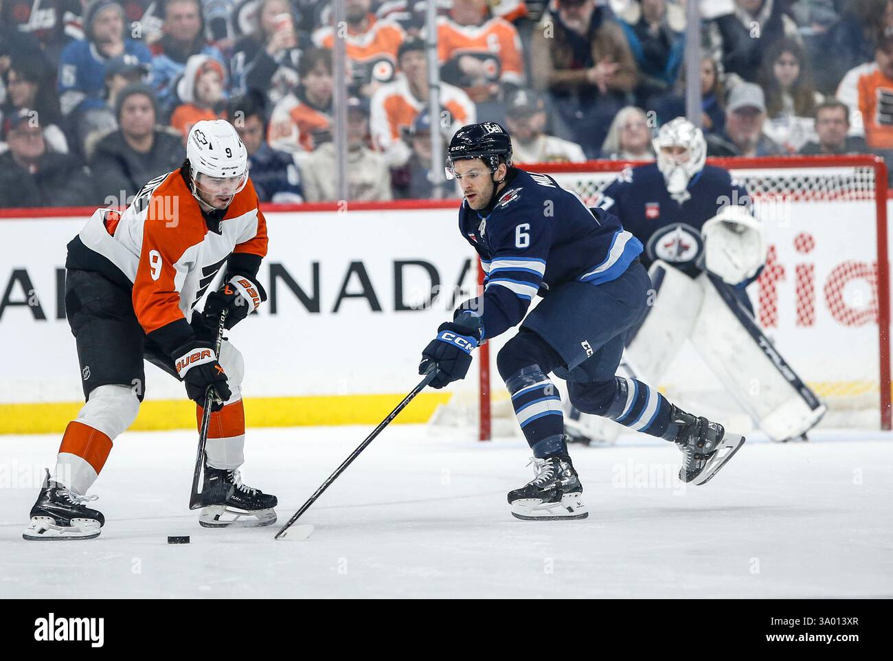 Winnipeg Jets' Colin Miller (6) defends against Philadelphia Flyers ...