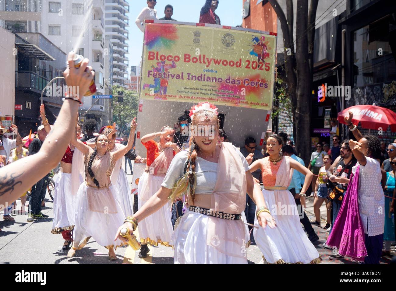 Revelers have fun at the carnival street in the Bollywood bloco party ...