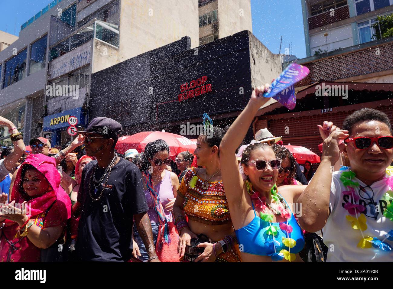 Revelers have fun at the carnival street in the Bollywood bloco party ...