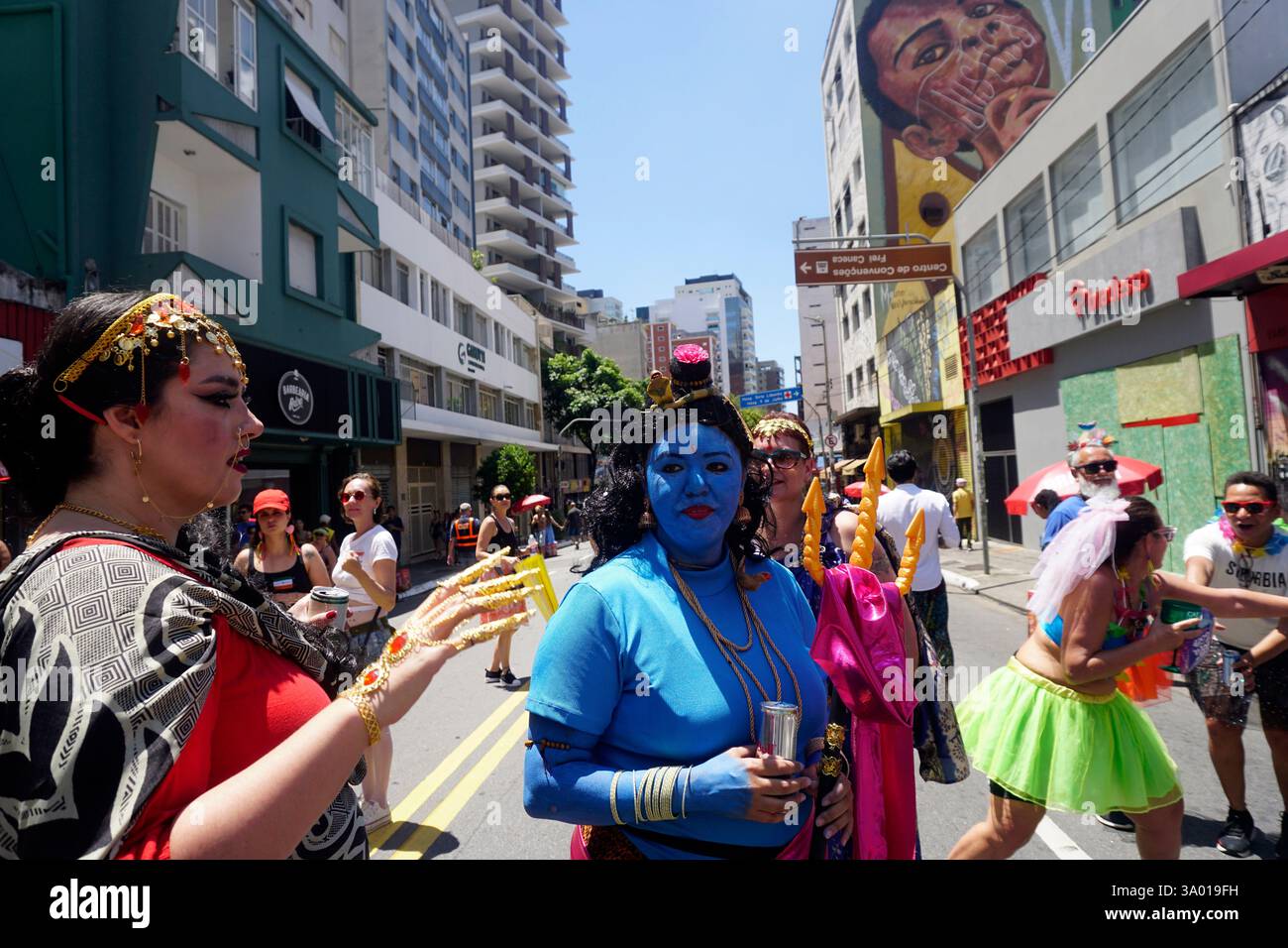 Revelers have fun at the carnival street in the Bollywood bloco party ...