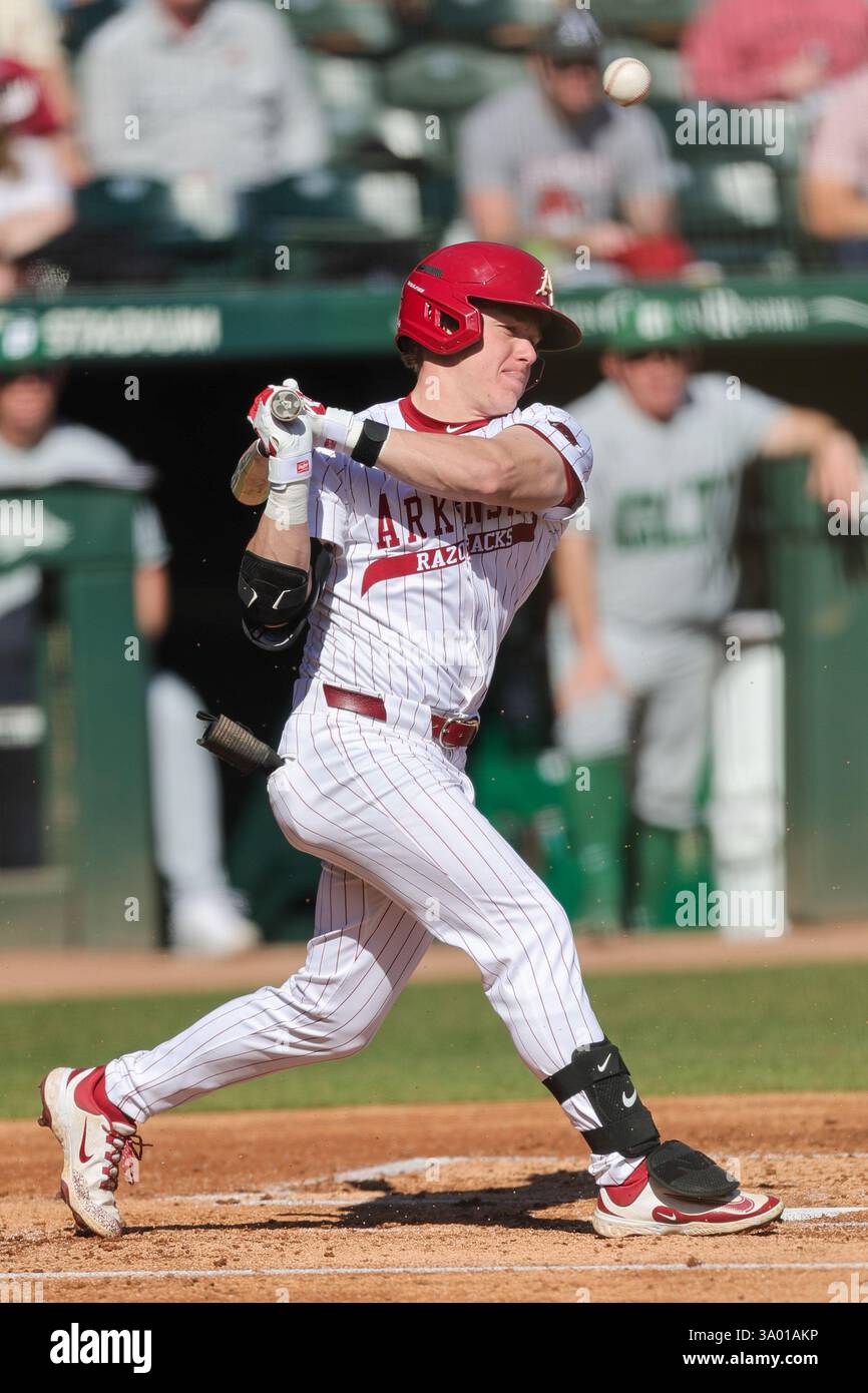 March 1, 2025: Charles Davalan (24) of Arkansas finishes up his swing ...