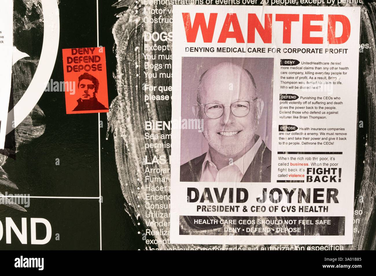 Wanted posters of various health care executives are seen in Lower ...