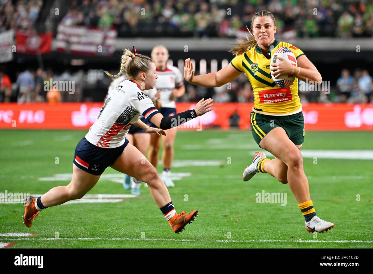 Australian Jillaroo Jessica Sergis runs around England's Georgie Dagger to score a try during ...