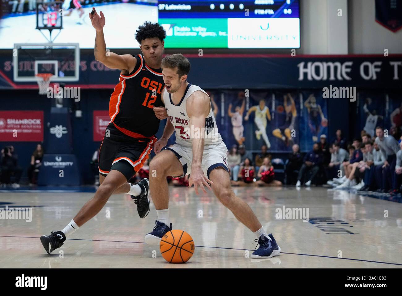 Saint Mary's guard Augustas Marciulionis, right, moves the ball while ...