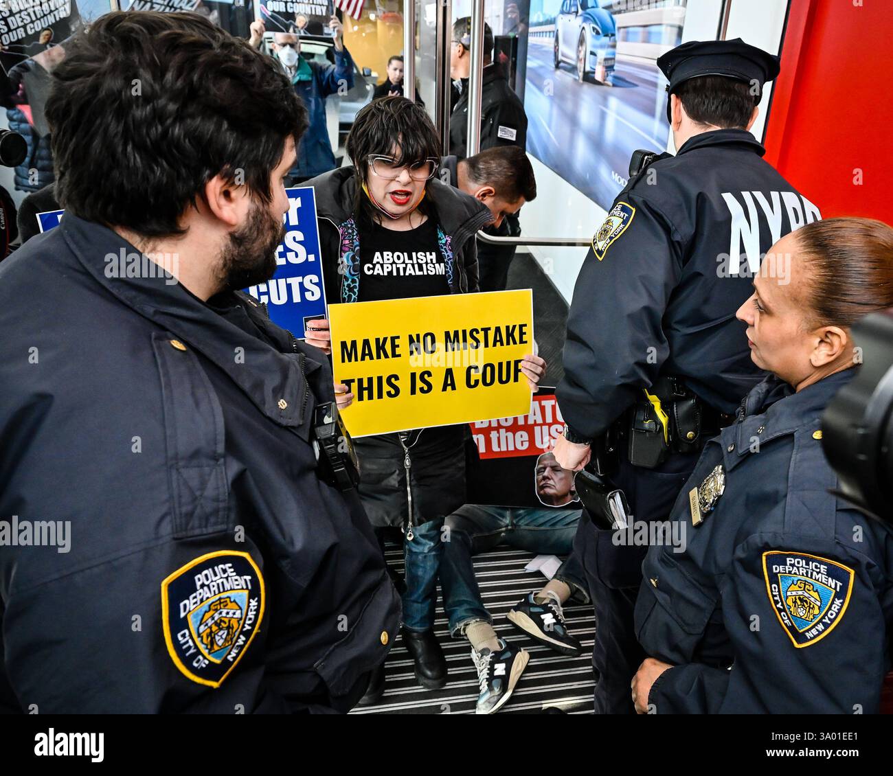 Members of the political action group Rise and Resist stage a sit-in ...