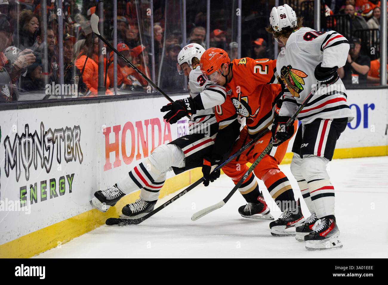 Anaheim Ducks right wing Brett Leason, center, and Chicago Blackhawks ...
