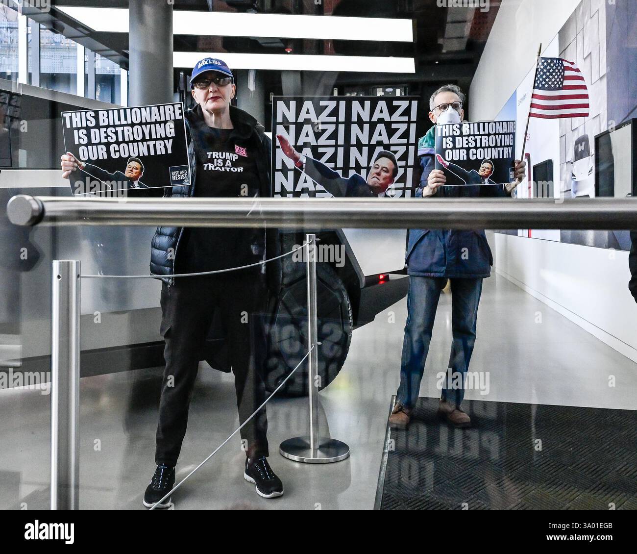 Members of the political action group Rise and Resist protest inside ...