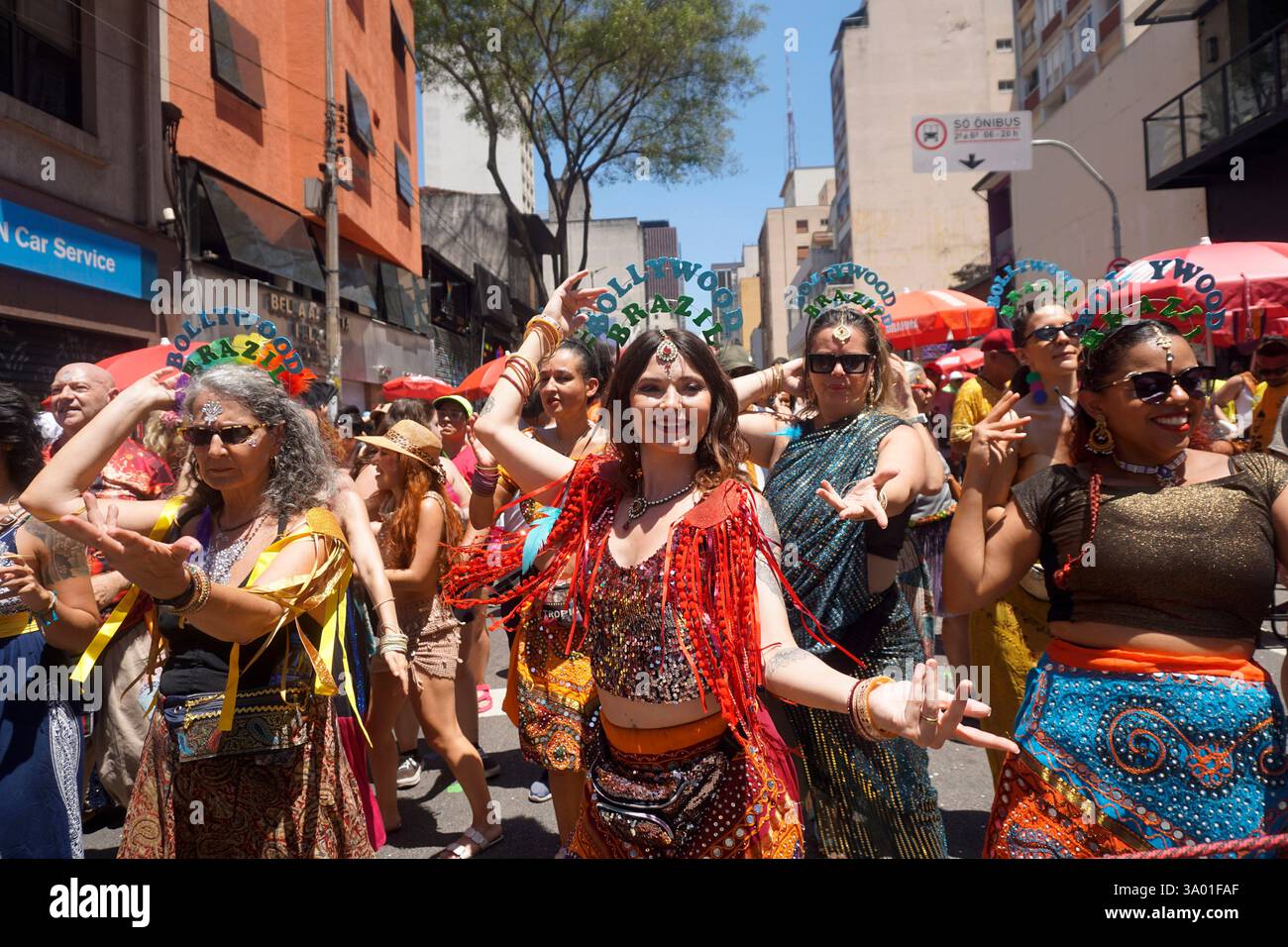 Revelers have fun at the carnival street in the Bollywood bloco party ...