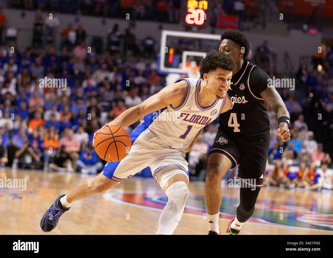 Florida guard Walter Clayton Jr. (1) drives on Texas A&M guard Wade ...