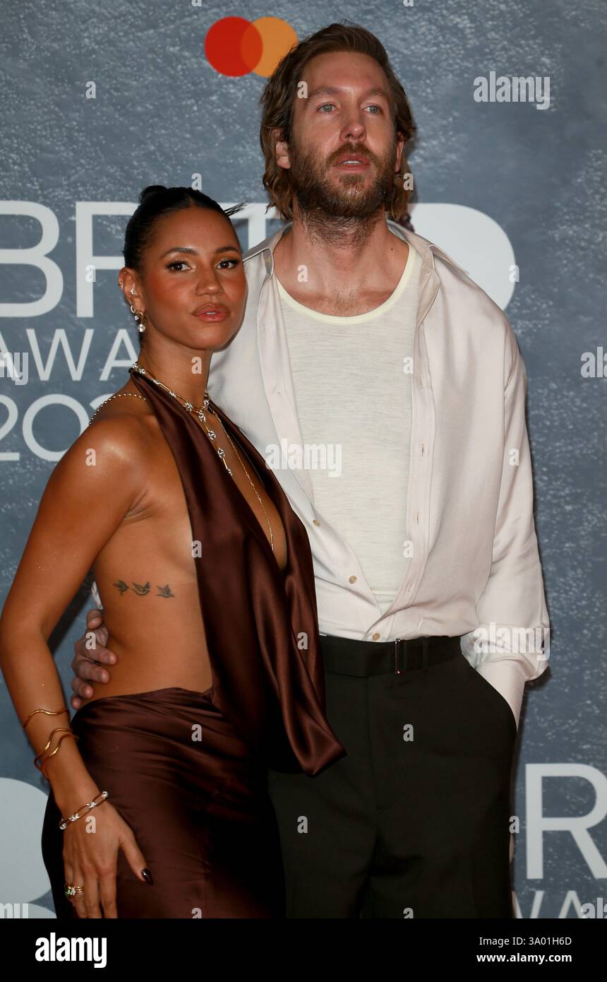 London, UK. 01st Mar, 2025. Vick Hope and Calvin Harris attend The BRIT ...