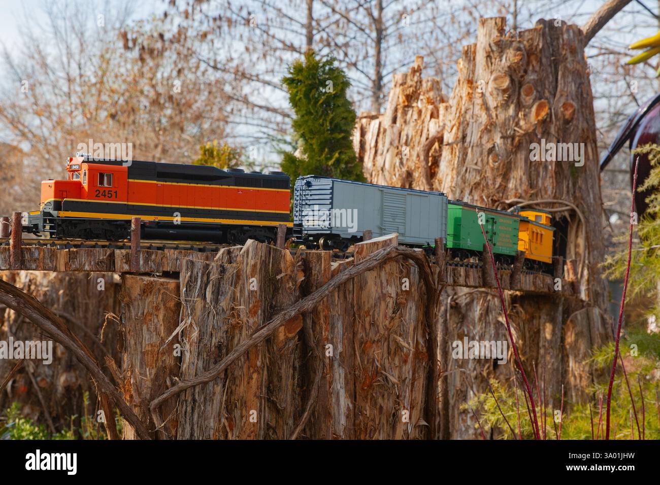 A detailed model freight train with a diesel locomotive and colorful ...