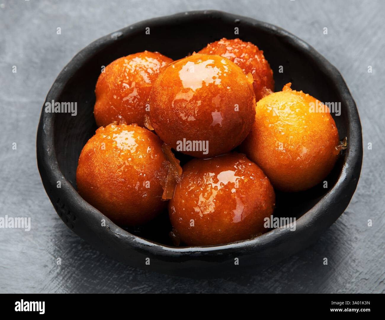 Gulab Jamun on gray background. Traditional oriental food concept Stock ...