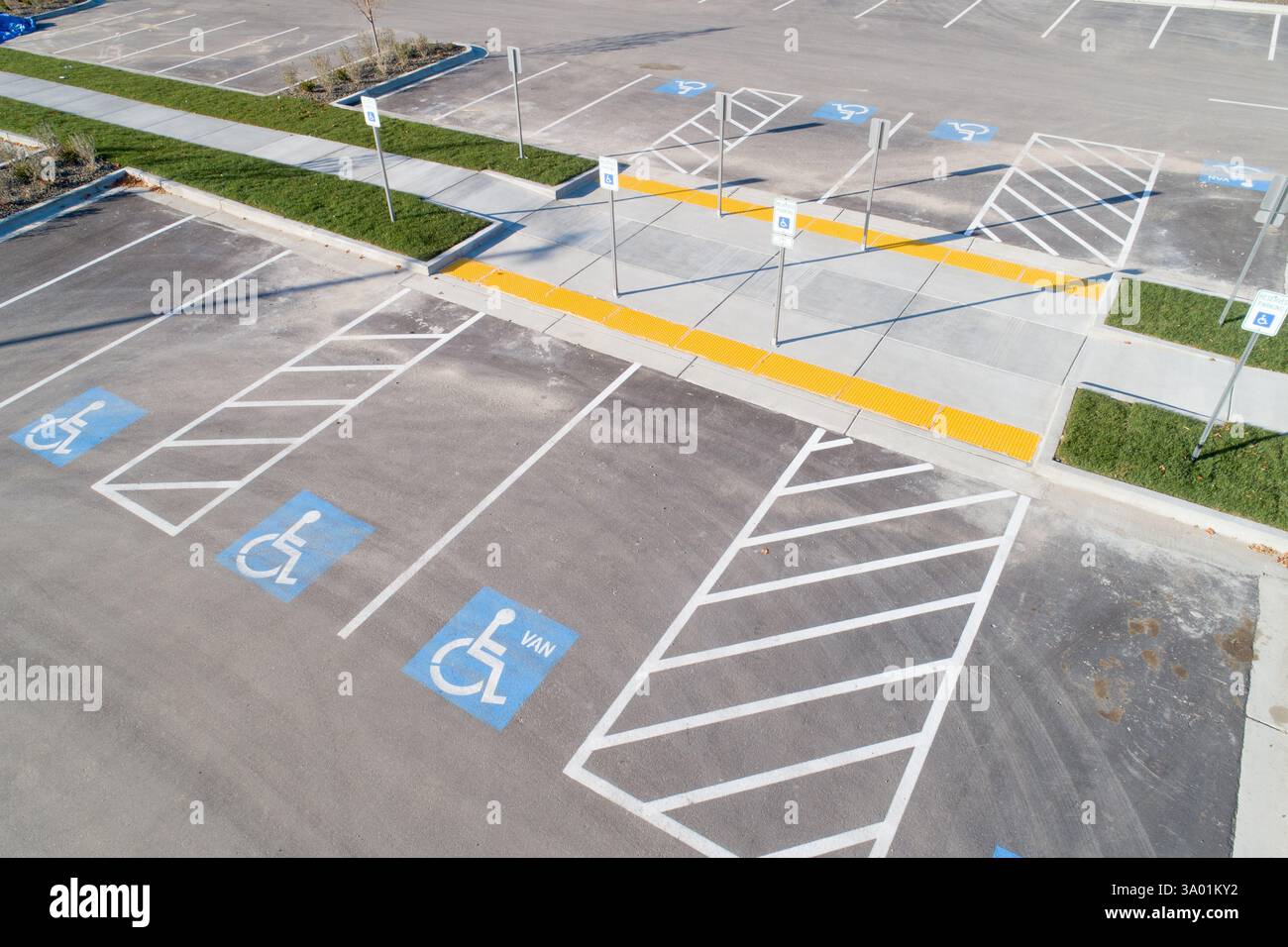 A parking lot with handicap parking spaces and a crosswalk Stock Photo ...