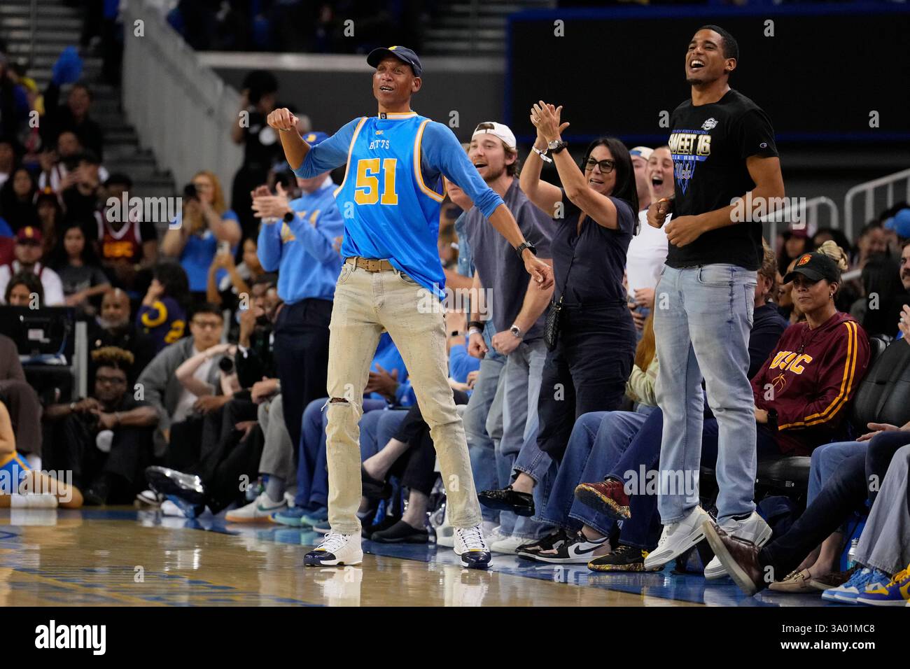 Former UCLA and NBA basketball player Reggie Miller celebrates during ...