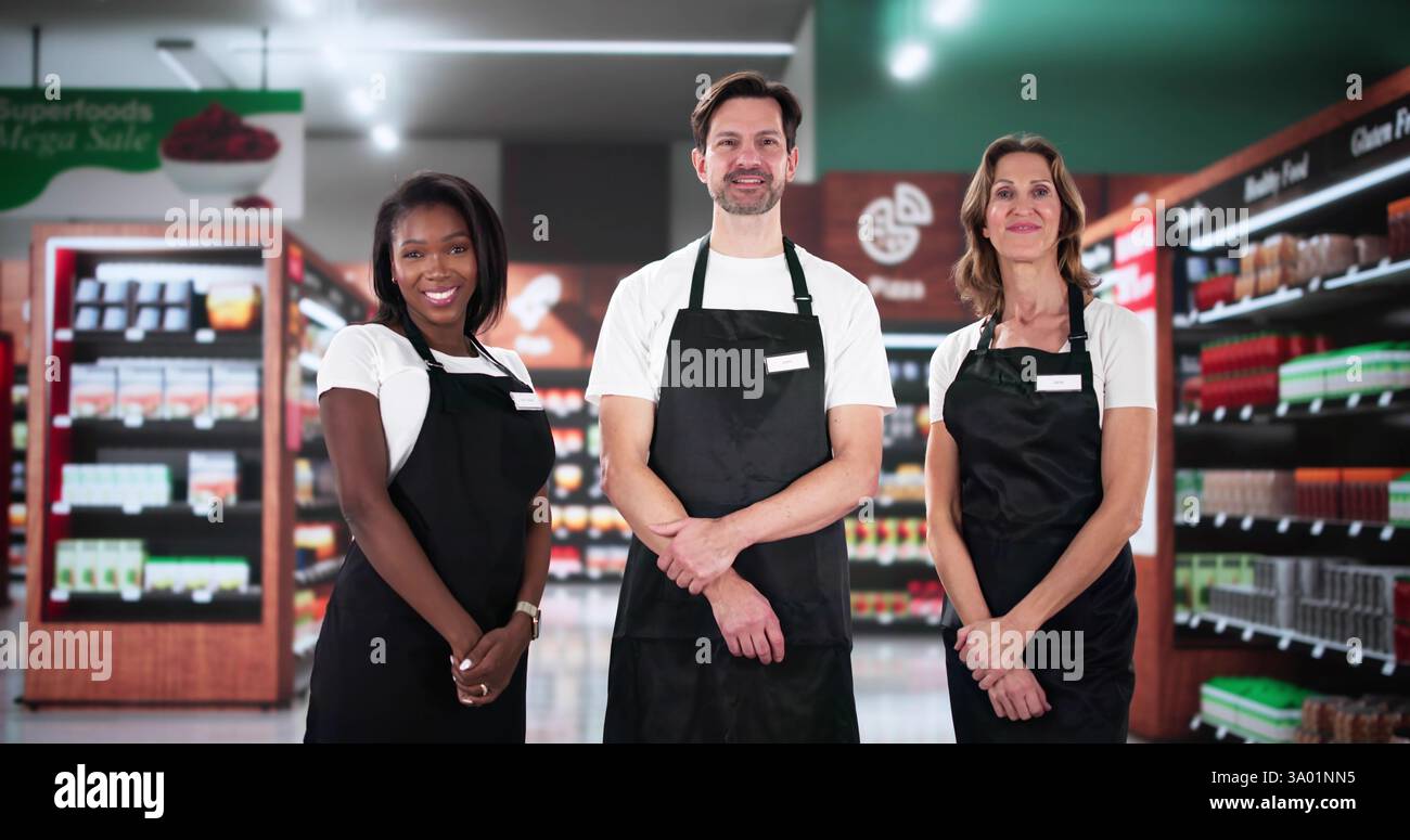 Smiling African-American executive manager leads diverse supermarket ...