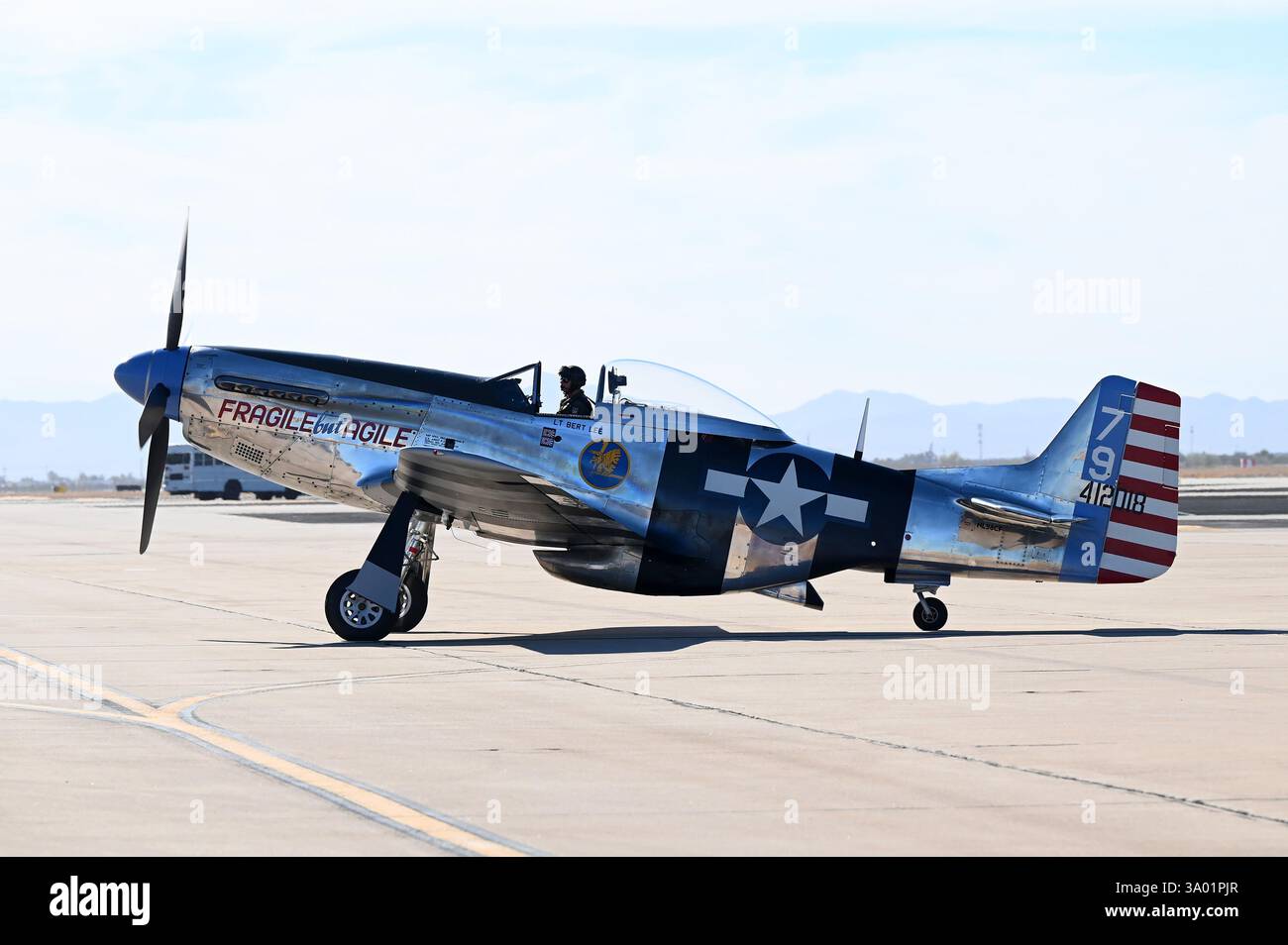 A P-51 Mustang aircraft taxis on the runaway after performing an aerial ...