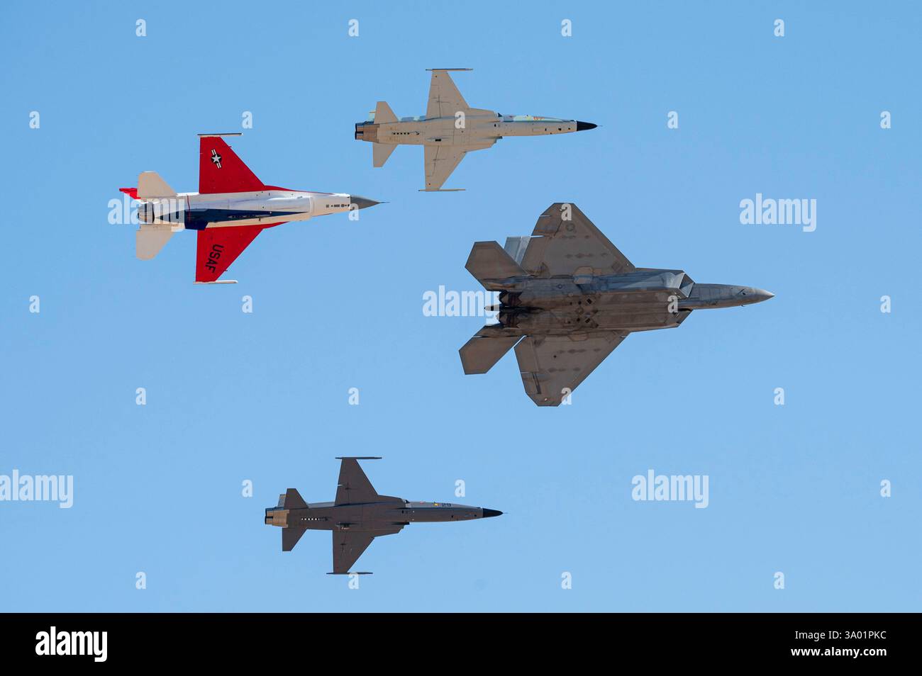 A U.S. Air Force F-22 Raptor aircraft, F-16 Fighting Falcon aircraft ...